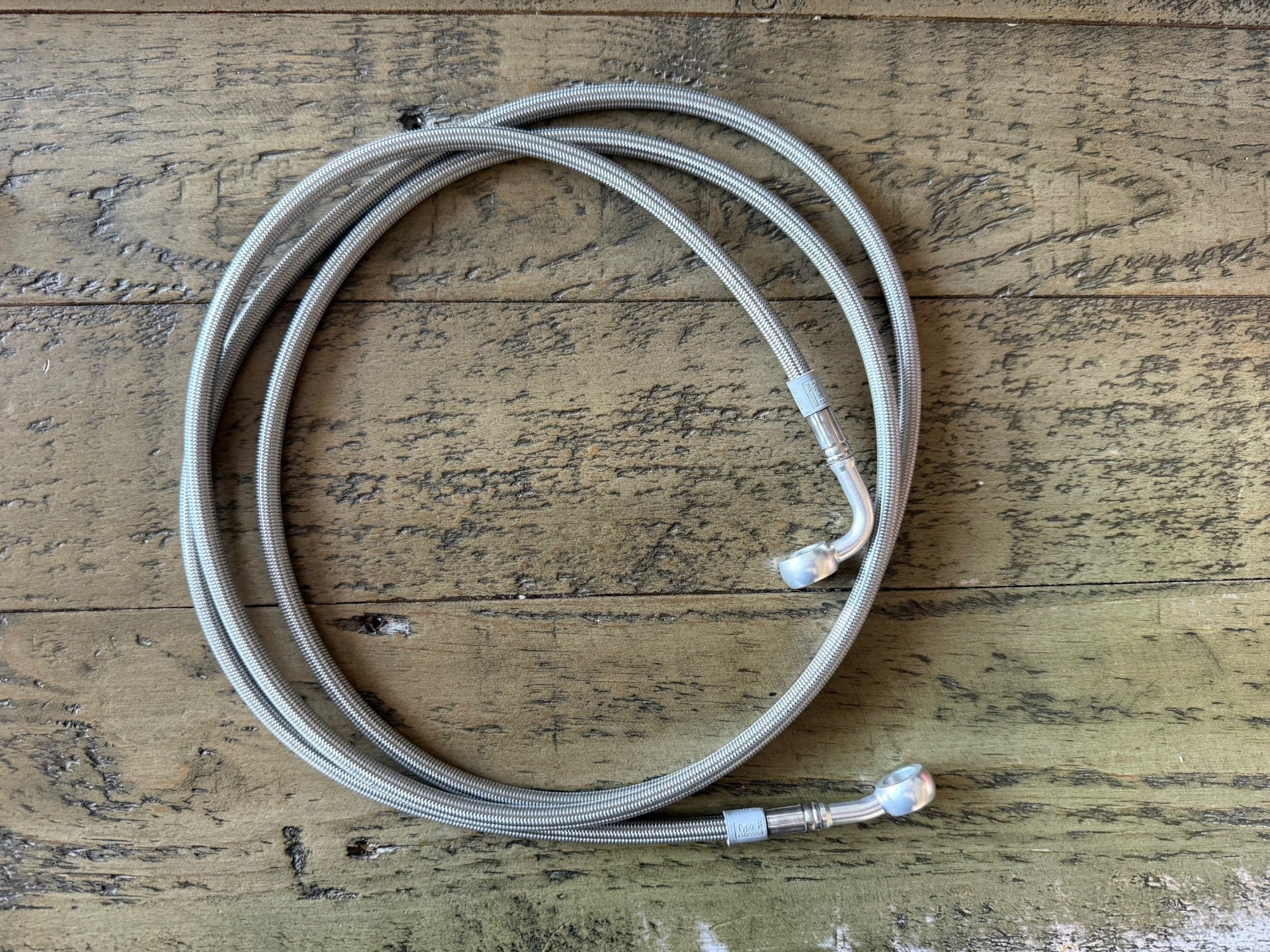 STAINLESS BRAIDED/CLEAR COATED BRAKE LINE 54" | Bourget's Bike Works